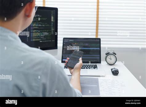 Software Development Concept Male Programmer Check Website Programming On Smartphone And