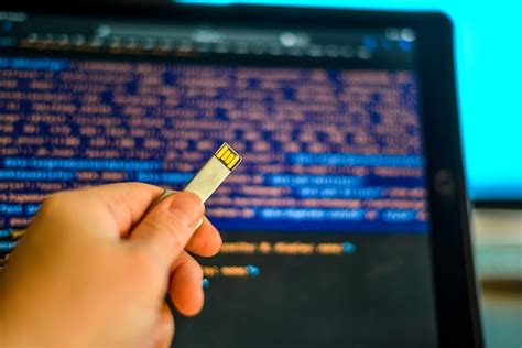 Premium Photo Cropped Hand Of Person Using Usb Key