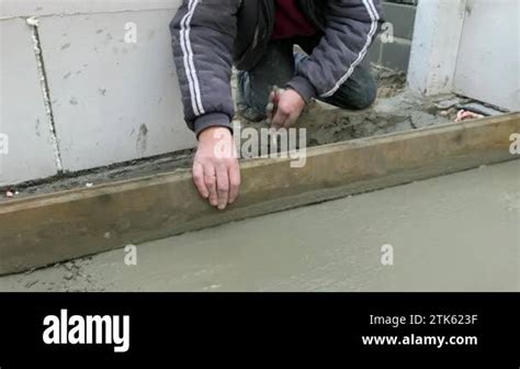 Concreting Of Reinforced Concrete Floor Worker Concretes Floor Pour Cement Mortar On