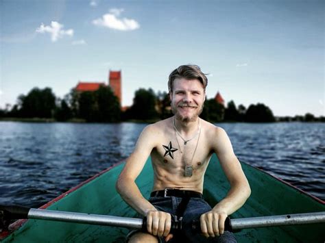 Premium Photo Portrait Of Smiling Shirtless Young Man Rowing Boat In River