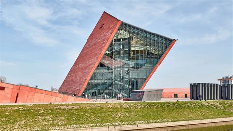 Tilted Red Tower Marks Entrance To Polish War Museum By Kwadrat