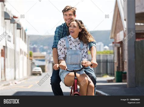 Happy Young Couple Riding On Image And Photo Bigstock