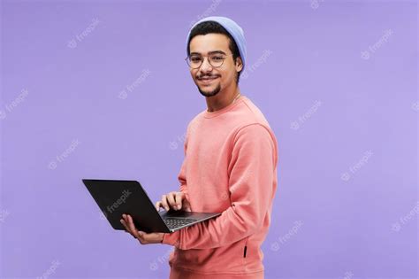 Premium Photo Young Successful Male Freelancer Or Programmer Holding