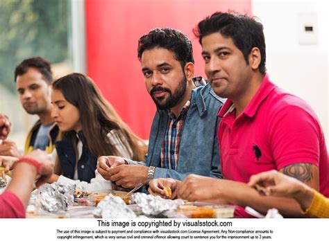 Group Of Indian College Friends Eating Cuisine Food Lunch Break In