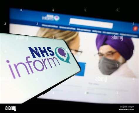 Smartphone With Logo Of Scottish Health Information Service Nhs Inform On Screen In Front Of