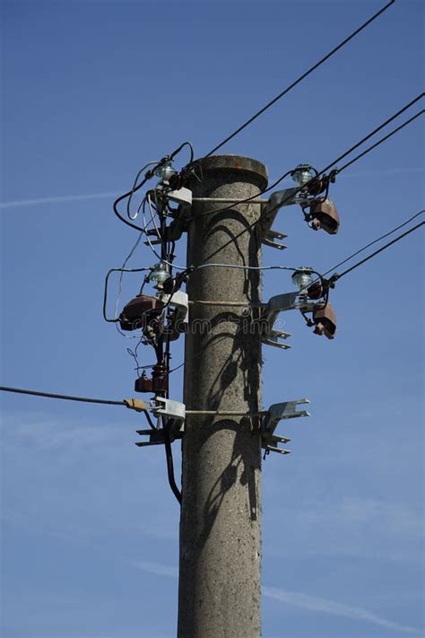 Electric Post With Wire And A Blue Sky Background Stock Image Image