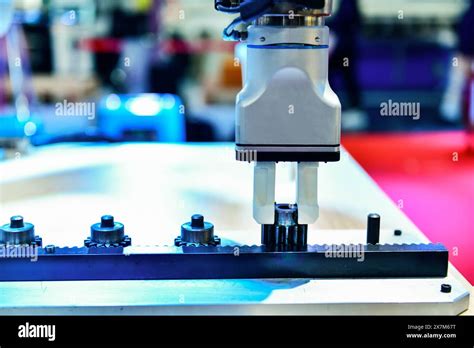 Modern Robot Arm Automation System Moving Metal Gear Parts In Factory