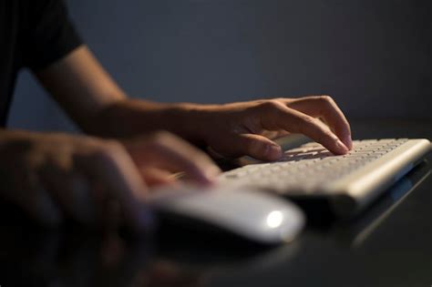Premium Photo Midsection Of Person Using Keyboard And Mouse Hacker