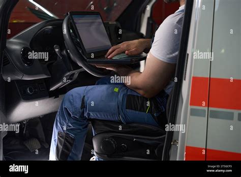 Experienced Auto Mechanic Performing Computer Diagnostic Test On Client Car Stock Photo Alamy