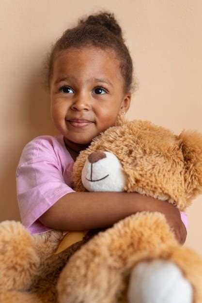 Free Photo Front View Girl With Stuffed Toy