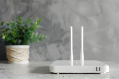 New White Wifi Router On Grey Textured Table Premium Ai Generated Image