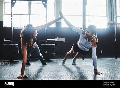 Motivation Makes All The Difference Two Young Women Giving Each Other