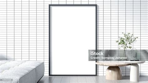 흰색 타일 벽 흰색과 회색 소파 빈 둥근 나무 연단 꽃병 램프 책 바이올린 무화과 고급 인테리어 디자인 아파트 3d 렌더링에 큰 빈 흰색 포스터 프레임 0명에 대한 스톡