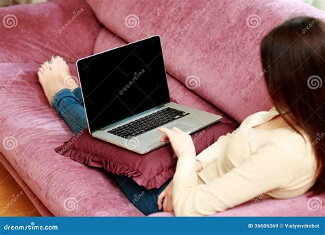 Woman Lying On The Sofa With Laptop At Home And Looking On The Blank Screen Stock Image Image