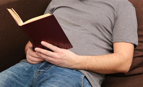 Man Lying On Sofa And Reading Book At Home Stock Image Image Of Indoors Couch