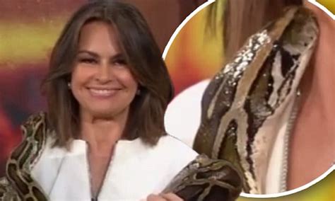 Lisa Wilkinson Puts On Brave Face While Holding Huge Python Snake
