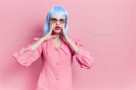 Pretty Woman In Blue Wig Pink Dress Red Lips Lifestyle Posing Stock