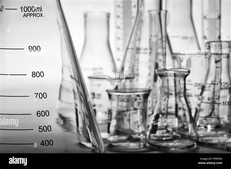 Glass Conical Erlenmeyer Flask And Assorted Empty Laboratory Glassware