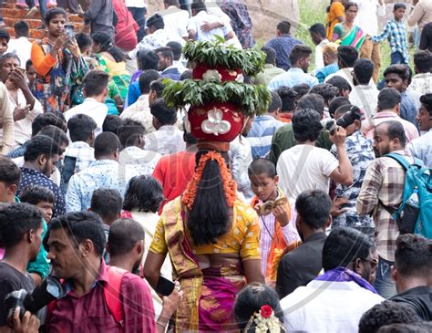 Image Of Woman Carrying Bonam On Head At Golconda Fort During Telangana Bonalu Festival
