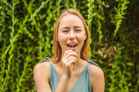 Premium Photo Woman Doing Dna Test With Cotton Swab Test For Home Use
