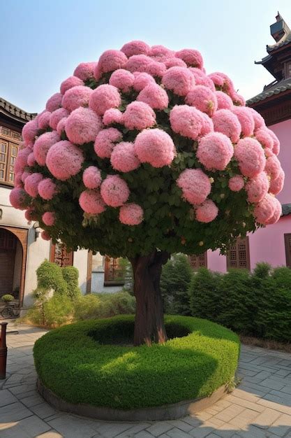 Premium AI Image A Pink Tree With A Large Pink Flower In The Middle Of It