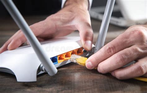 Man Plugging Internet Cable Into Wifi Router Stock Image Image Of Connection Signal