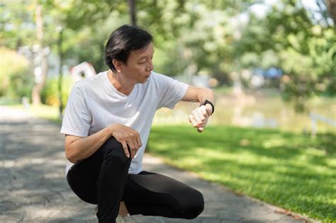 Wellness And Fitness Man Checking Smartwatch After Workout In Park Stock Image Image Of