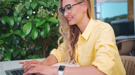 Woman Freelancer Coding At Outdoor Restaurant On Laptop 46156084 Stock Video At Vecteezy