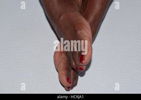 Beautiful African Feet Pedicured With Red Nail Polish Stock Photo Alamy