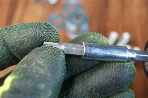 Inserting A Torx Bit Into The Bit Adapter Close Up Of The Work Process
