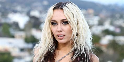 Miley Cyrus Stuns In A Prom Perfect Two Tone Thigh High Slit Gown At Versace Fashion Show