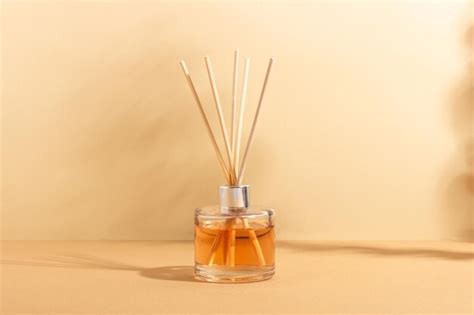 Premium Photo Reed Diffuser Bottle On A Beige Background Incense Sticks For The Home With A