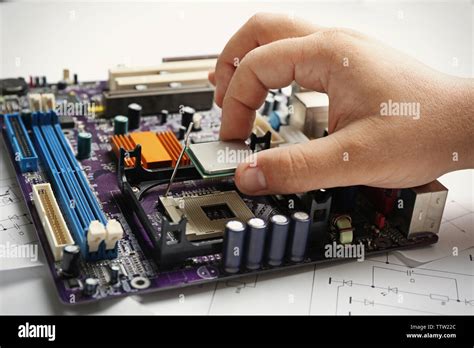 Man Installing Microprocessor On Motherboard Close Up Stock Photo Alamy