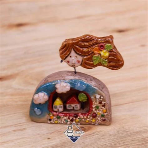 مجسمه سفالی دخترک طرح یک فروشگاه ایدرا