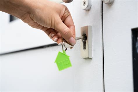 woman using key to open door stock image image of modern entrance