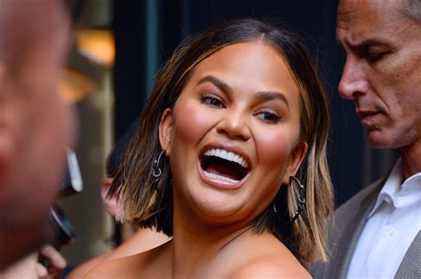Watch Chrissy Teigen Almost Lose It Going Through A Haunted House On