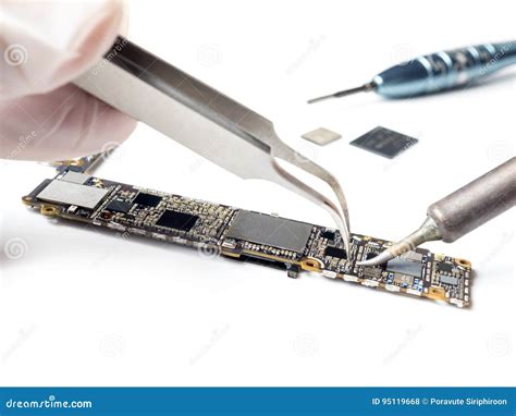 Technician Replacing Microchip Of Smartphone Logic Board Stock Photo Image Of Nand