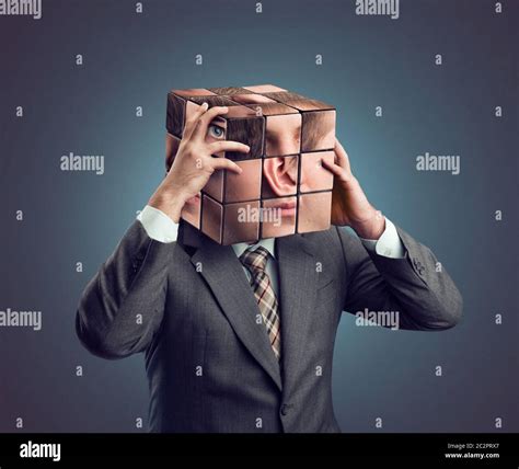 Man Holding His Rubik Cube Head Stock Photo Alamy