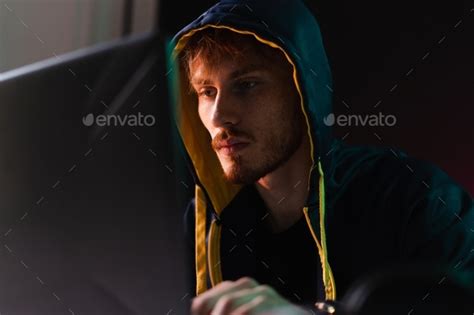 Hacker It Genius Using Laptop Writing Code Wearing Hood On Head Cyber Security Concept Stock