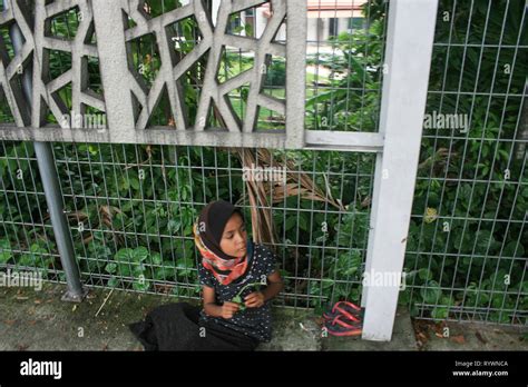 Young Girl Begging For Money On The Path In Kuala Lumpur Malaysia