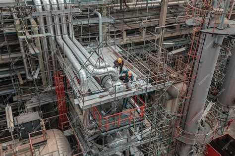 premium photo male worker inspection at steel long pipes and pipe
