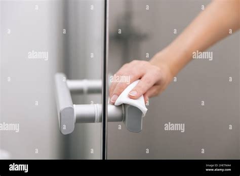 Cleaning Glass Door Handles With An Antiseptic Wet Wipe Sanitize Surfaces Prevention In