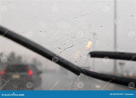 Motion Of Windscreen Wipers On Windshield With Blurred Traffic D Stock