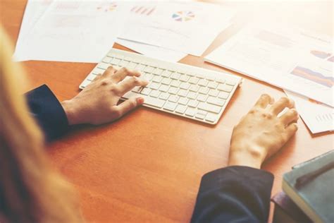 Free Photo Woman Using Keyboard And Mouse