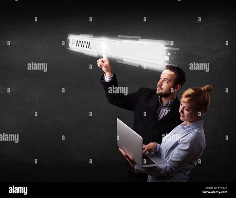 Young Business Couple Touching Web Browser Address Bar With Sign