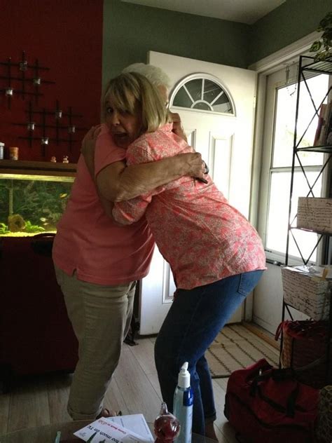 A Heartfelt Farewell Between A Short Mother And Her Much Taller