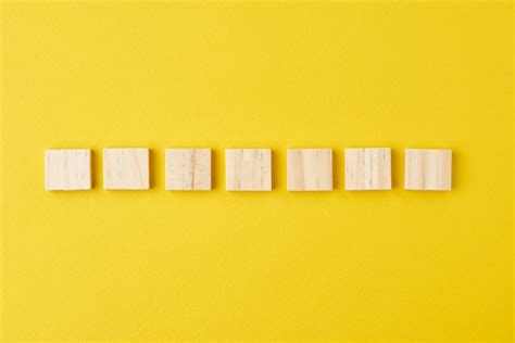 Premium Photo Wooden Blocks In Row Isolated On Yellow