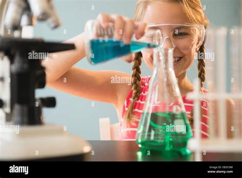Caucasian Girl Doing Science Experiment In Lab Stock Photo Alamy