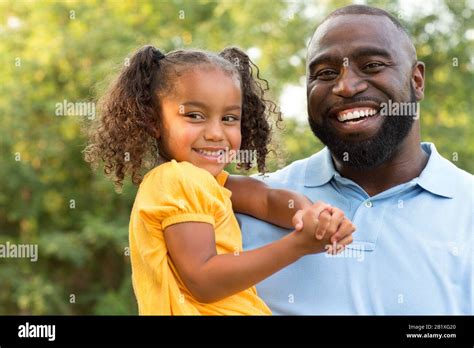 Father Laughing And Playing With His Daugher Stock Photo Alamy