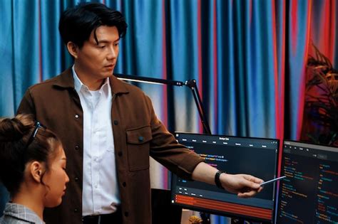 Premium Photo It Developers Discussing With Point Website Coding System Infobahn